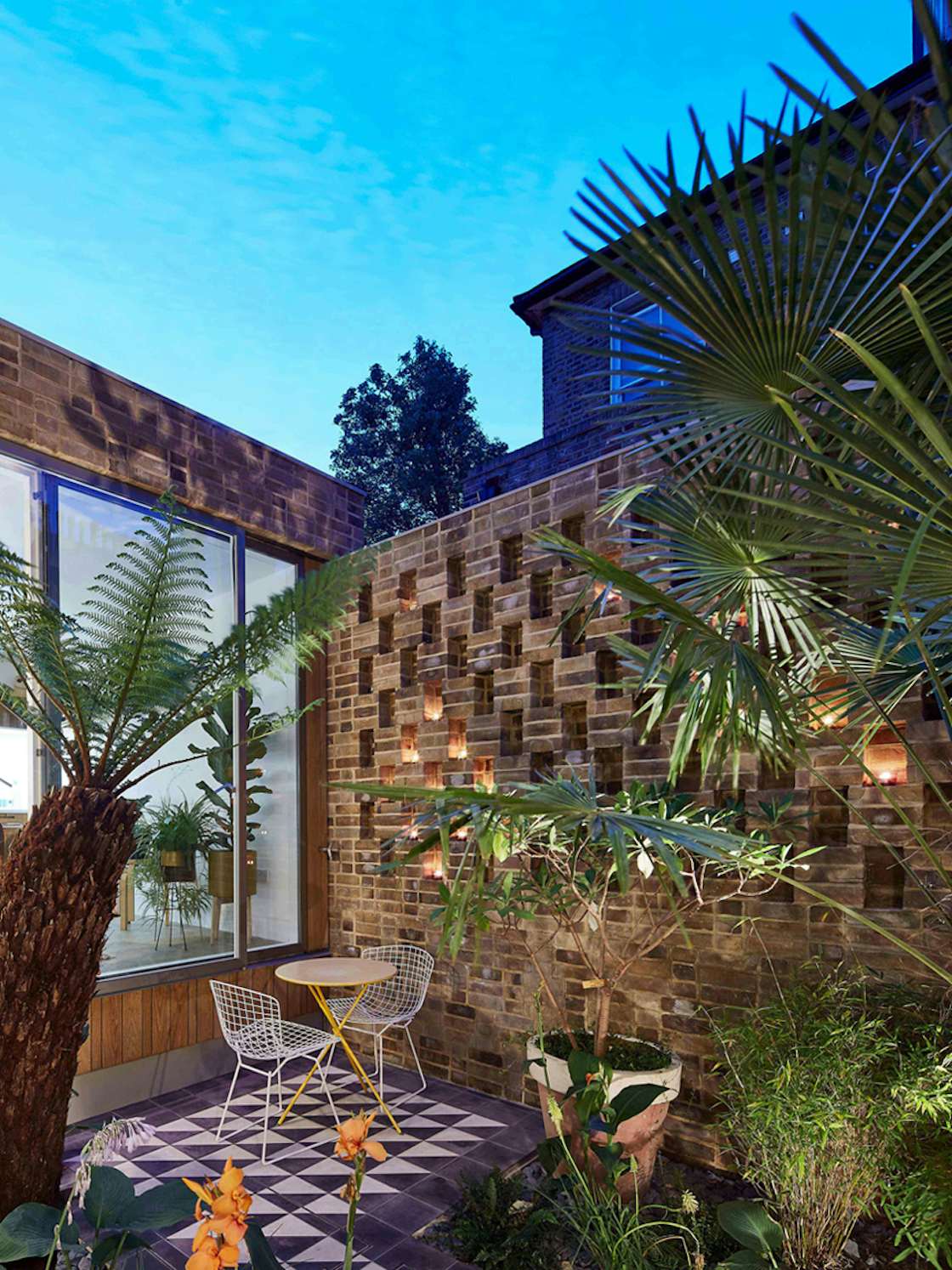 Photo 8 of 8 in A Perforated Brick Facade Shields a Glowing London ...