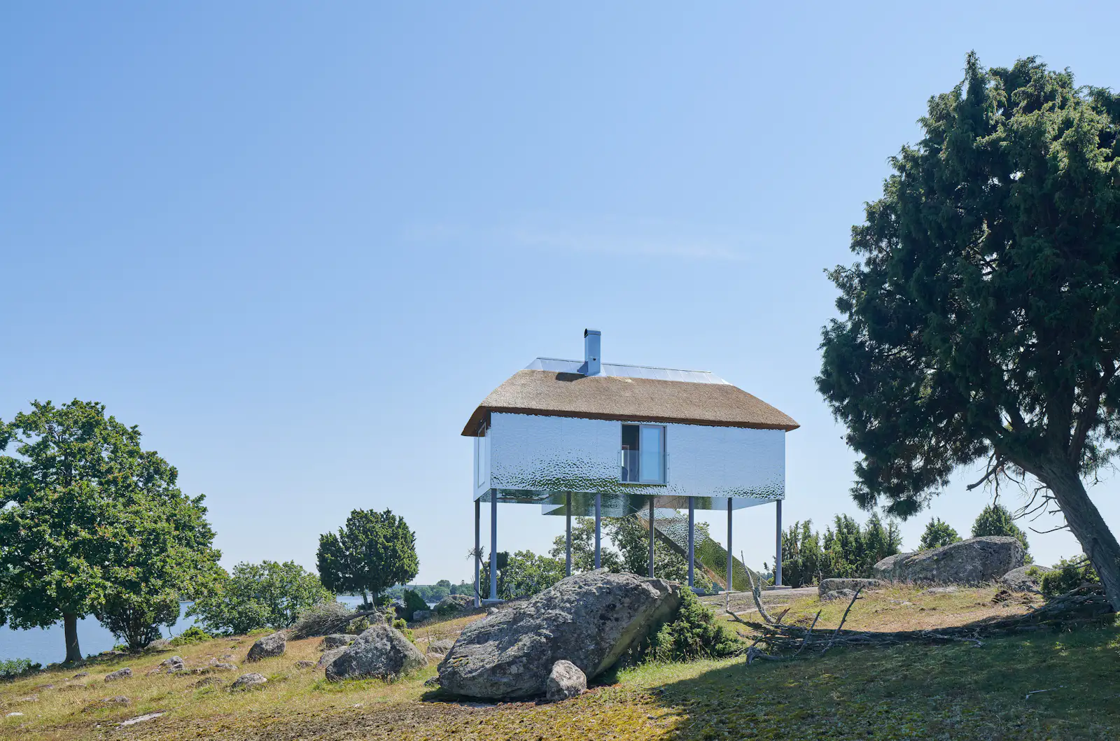 Photo 1 of 9 in A Surreal Mirrored Cabin Stands High Above the Earth in ...