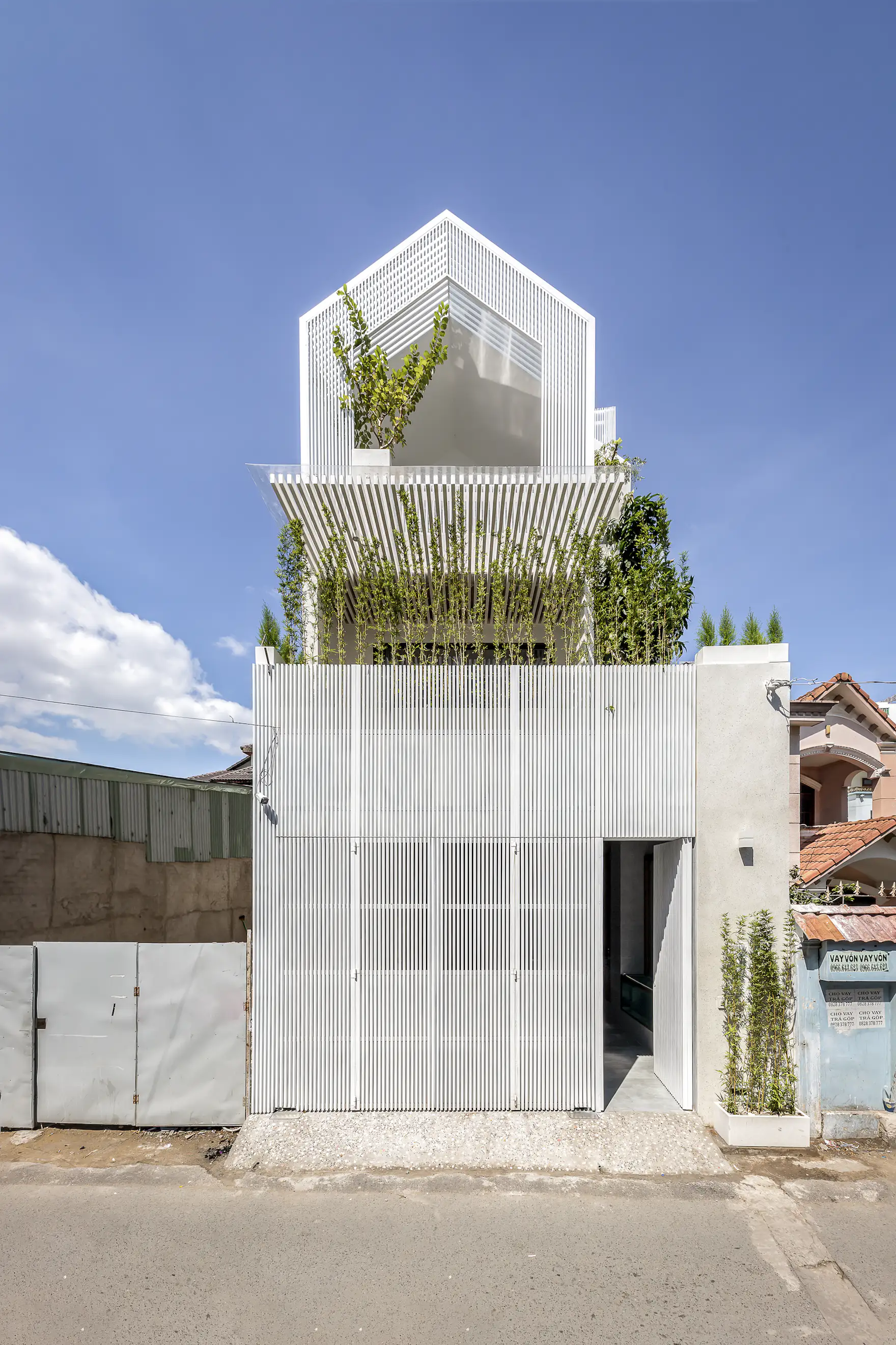 Photo 1 of 13 in A Light-Filled Atrium With a Tree House Anchors a ...