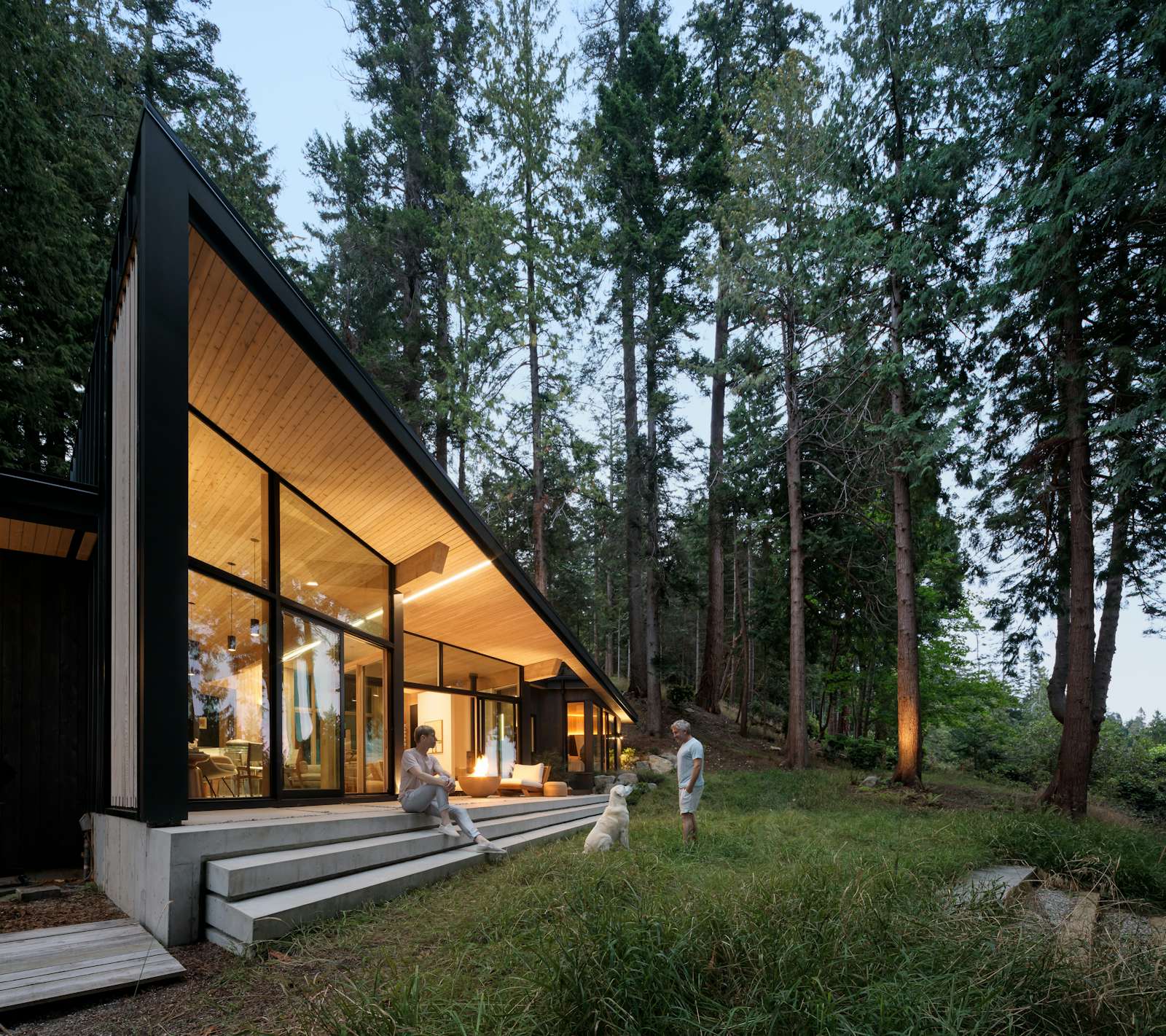 Photo 18 of 20 in An Angular Black Cabin Rises From the Woods Near ...