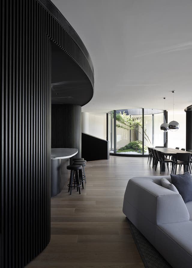 Photo 6 of 16 in An Undulating, Matte Black Home Hides a Secret Garden ...