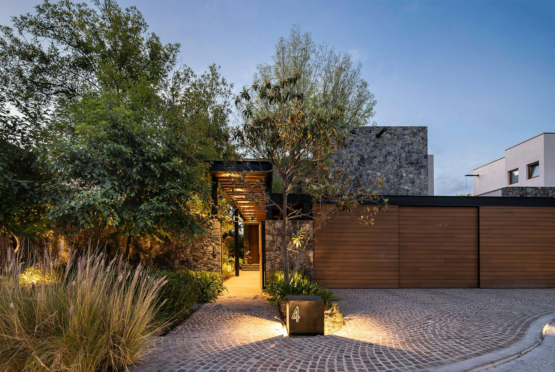 Photo 2 of 11 in A Stone Home Wrapped in Lush Greenery Seeks $2.9M in ...