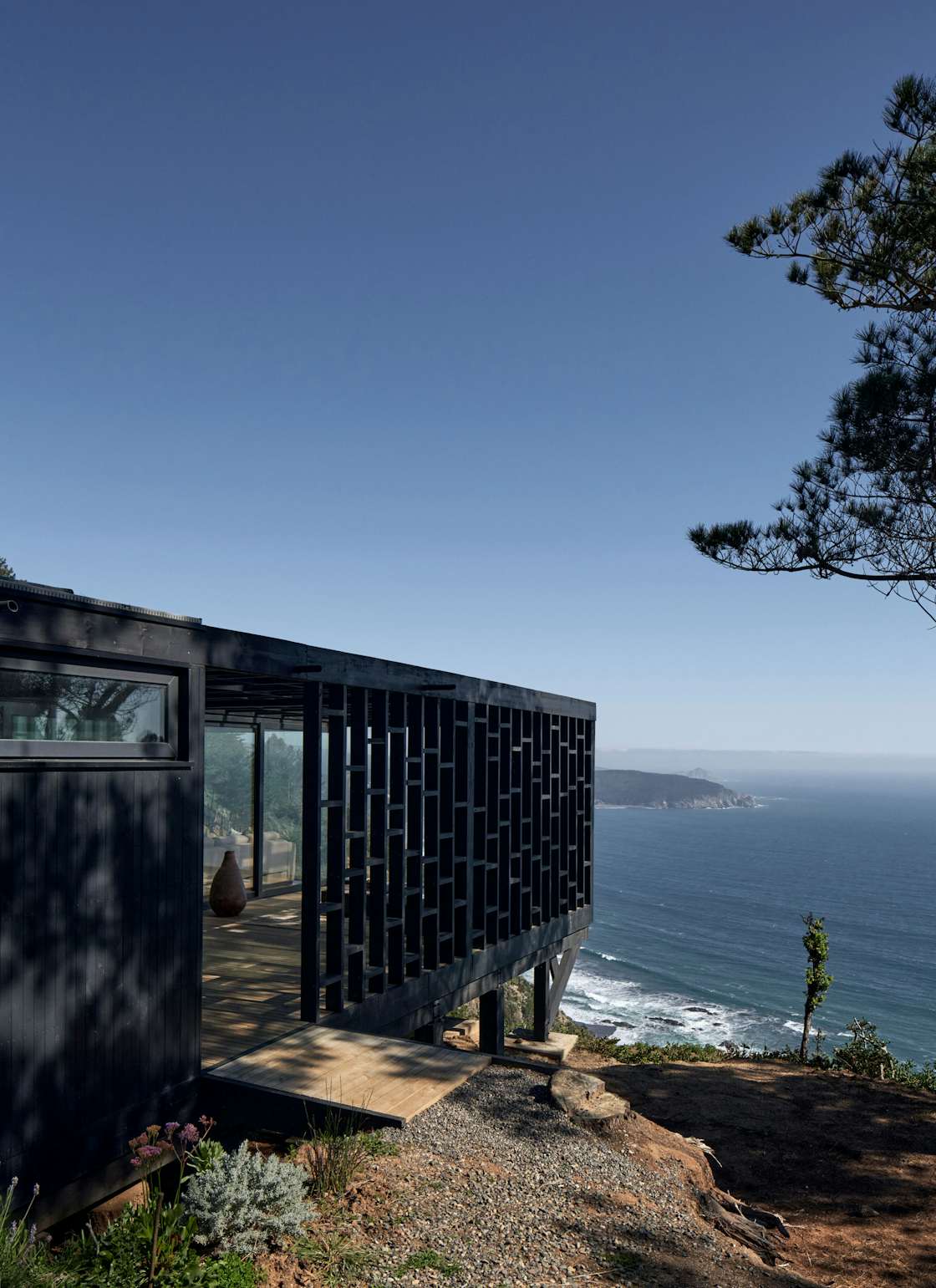 Photo 8 of 11 in A Surfer Couple Build an All-Black Off-Grid Cabin on a ...
