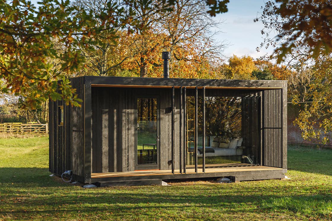 These Tiny “See-Through” Cabins Are Made of Charred, Waxed, and ...