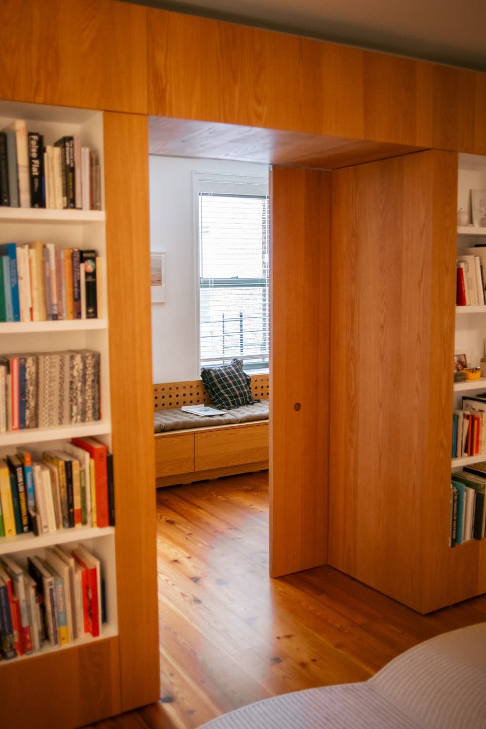 Photo 3 of 11 in A Multifunctional Storage Wall Solves a Tricky Spatial ...