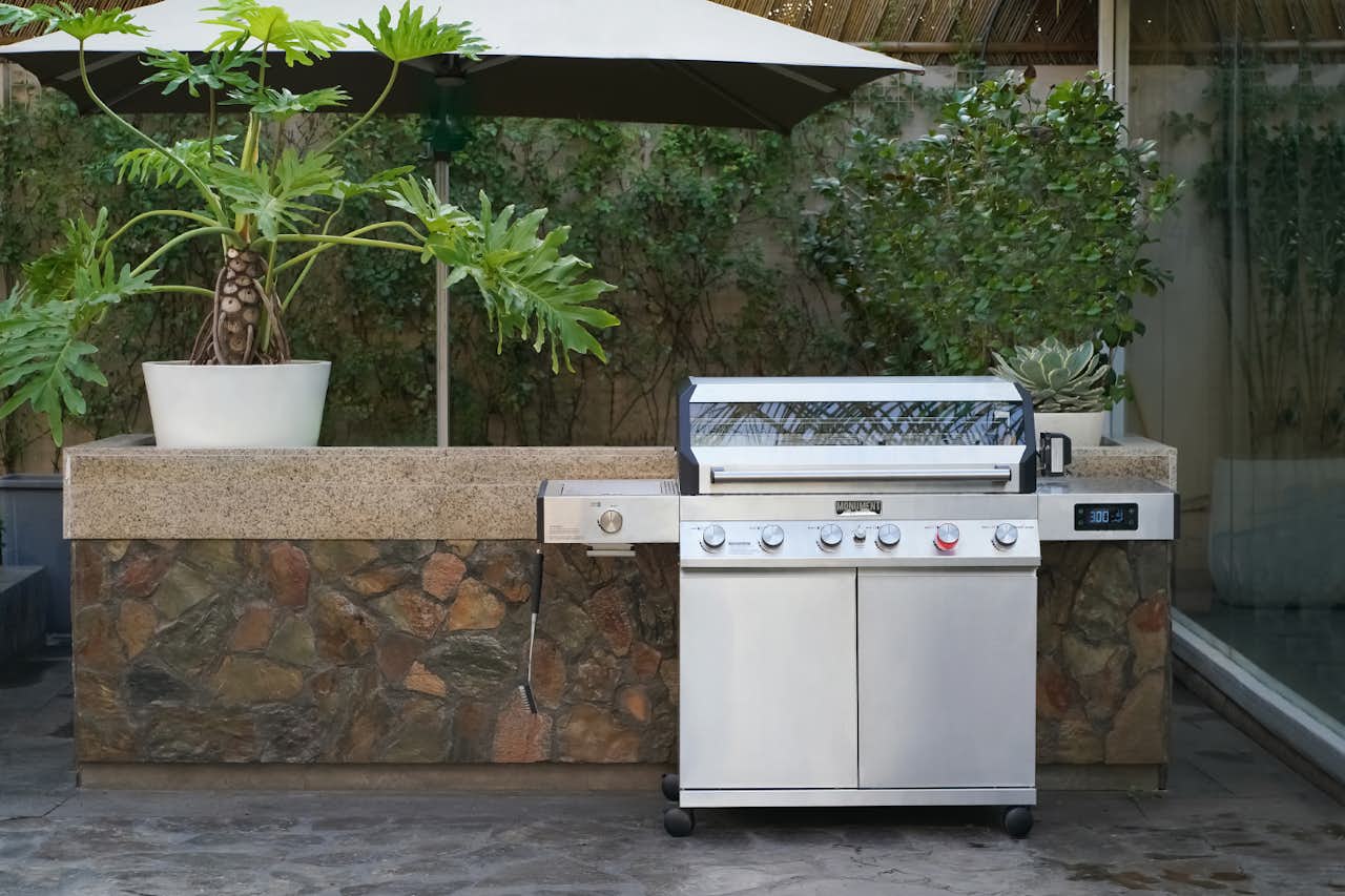 This Grill Lets You Spend More Time With Your Guests—and Less Time ...