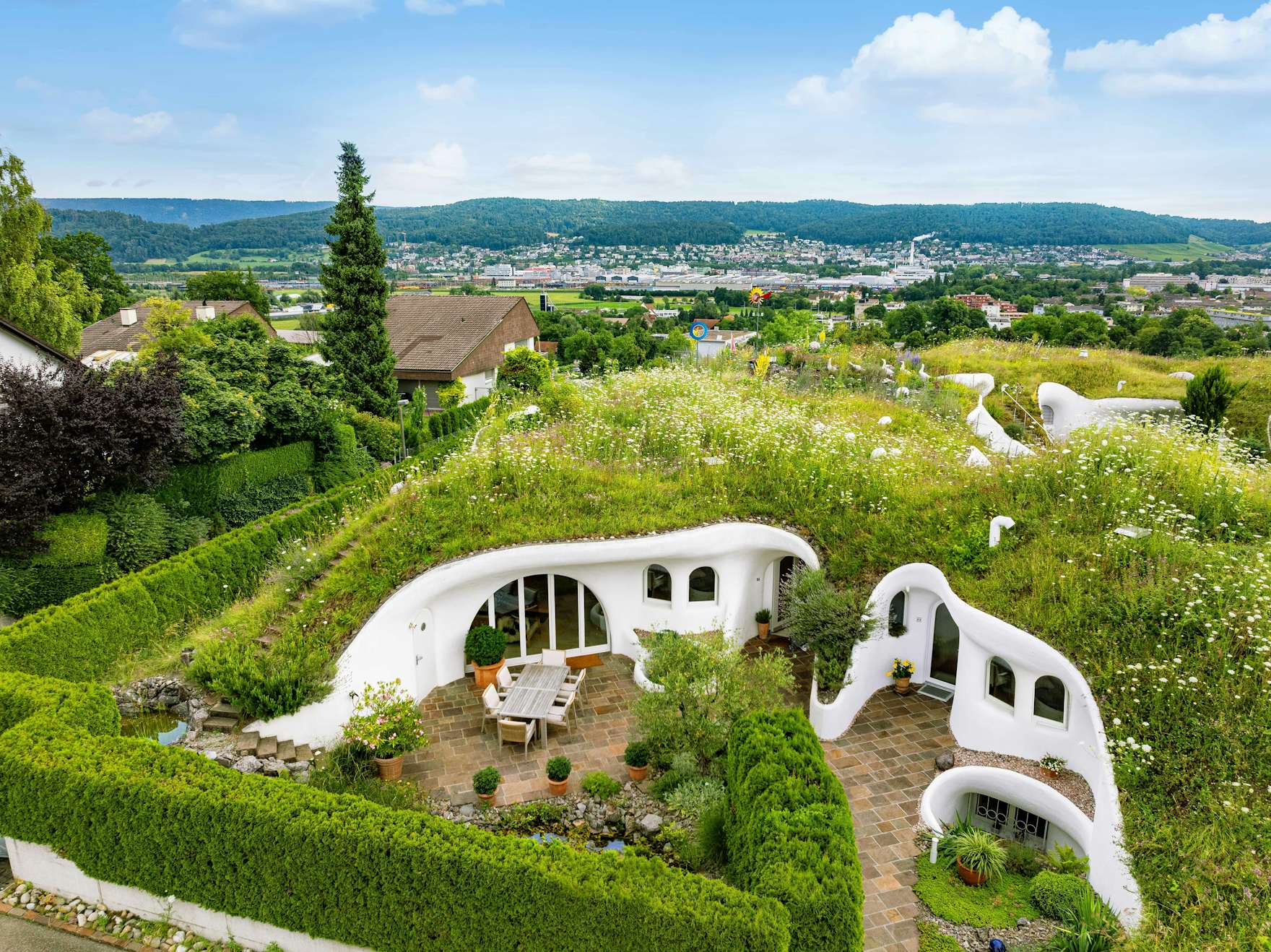 Photo 1 of 10 in The Grass Is Always Greener on This $3.4M Earth Home ...