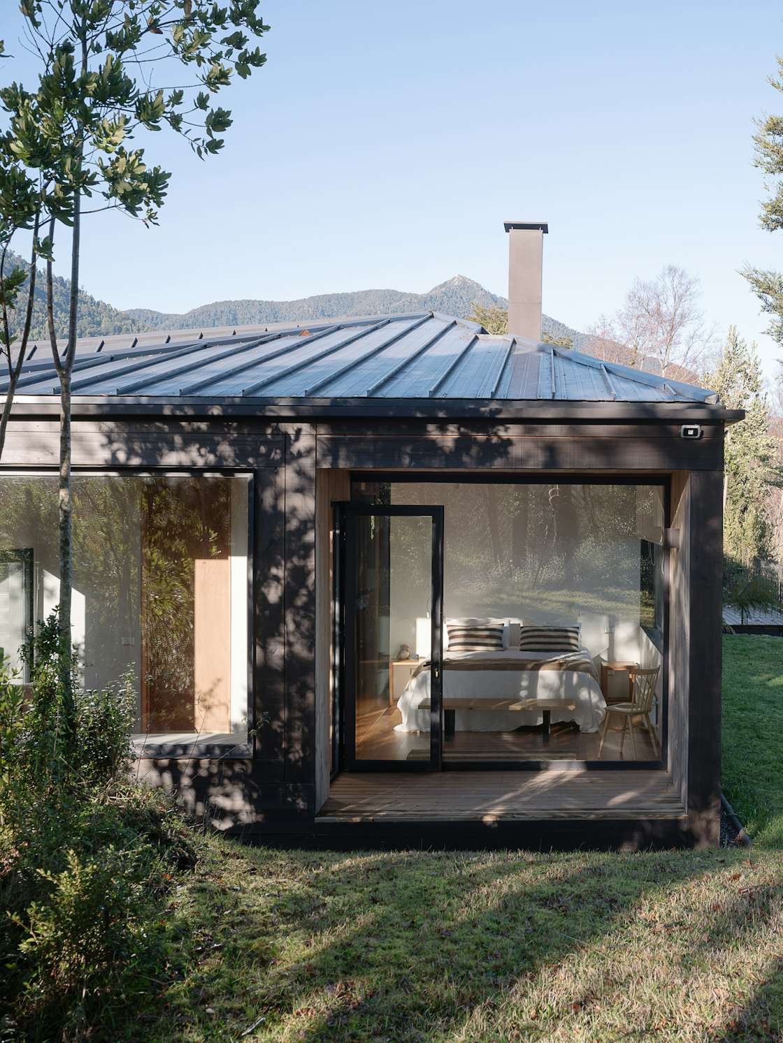 Photo 14 of 17 in A T-Shaped Cabin Hugs a Forested Hillside in Chile ...