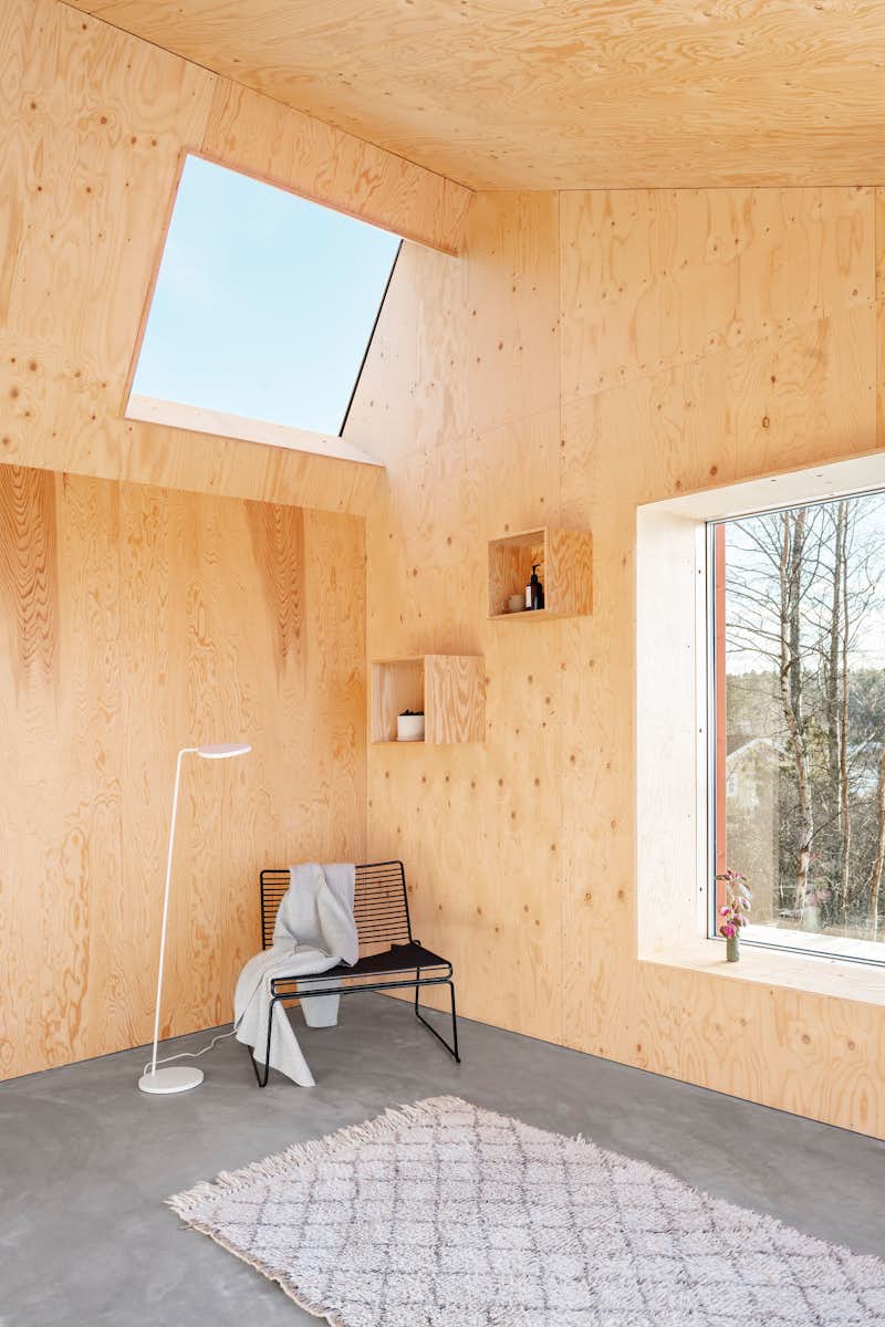 A Tiny Cabin in Rural Sweden Pops With Red Pinewood - Dwell