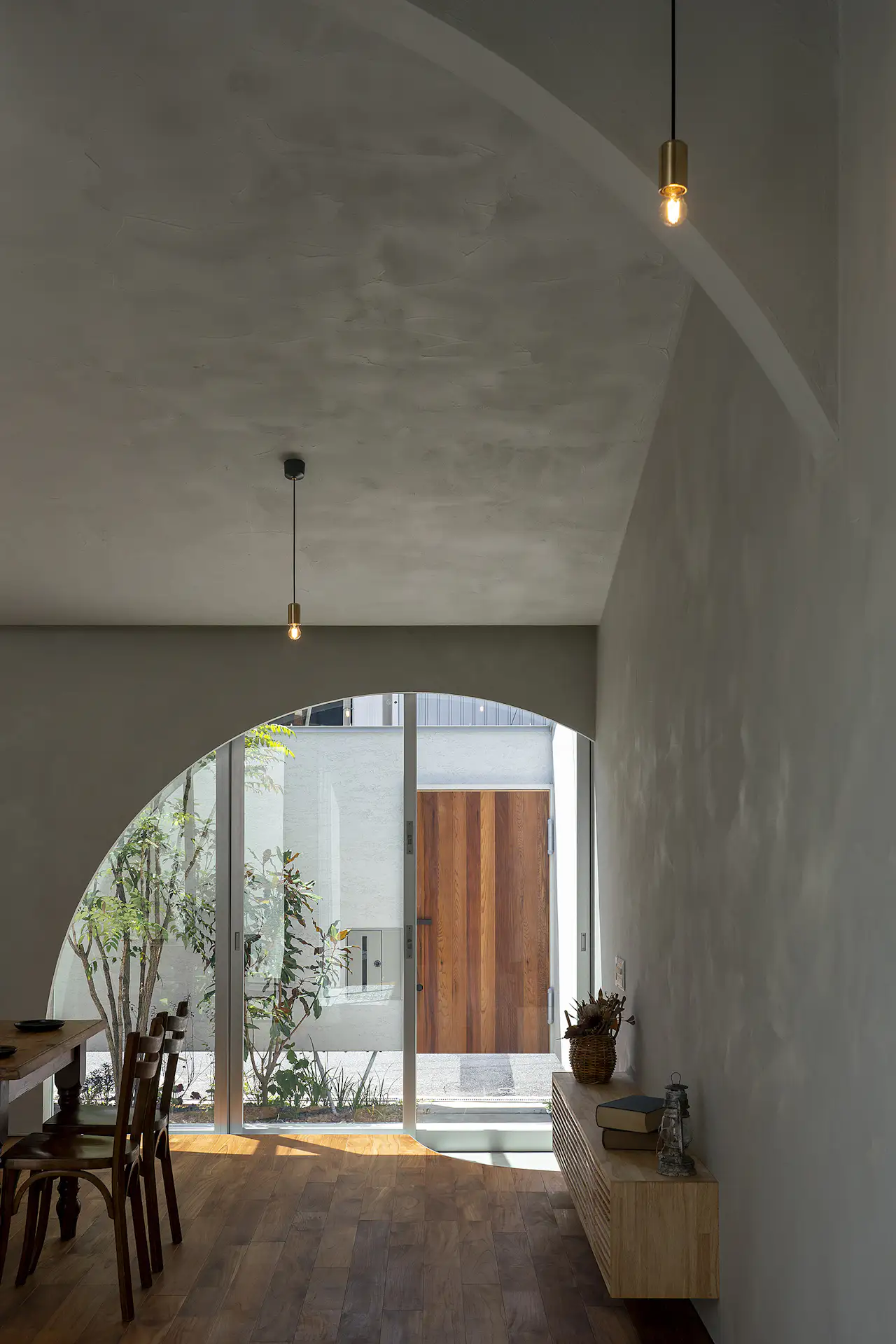 Photo 3 of 11 in A Compact House in Japan Is Defined by Dynamic Arches ...