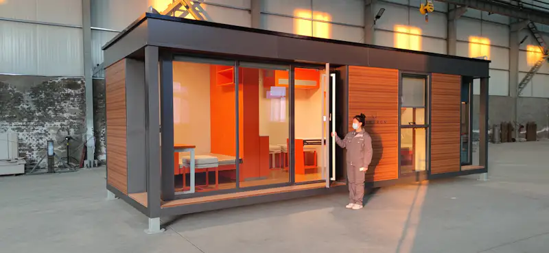 This Wood-Wrapped Prefab With Built-In Furniture Starts at $55K - Dwell