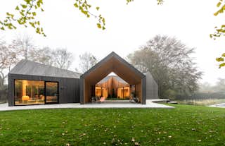 Photo 13 of 13 in An Undulating Roof Flows Across the Barn-Like Modules ...