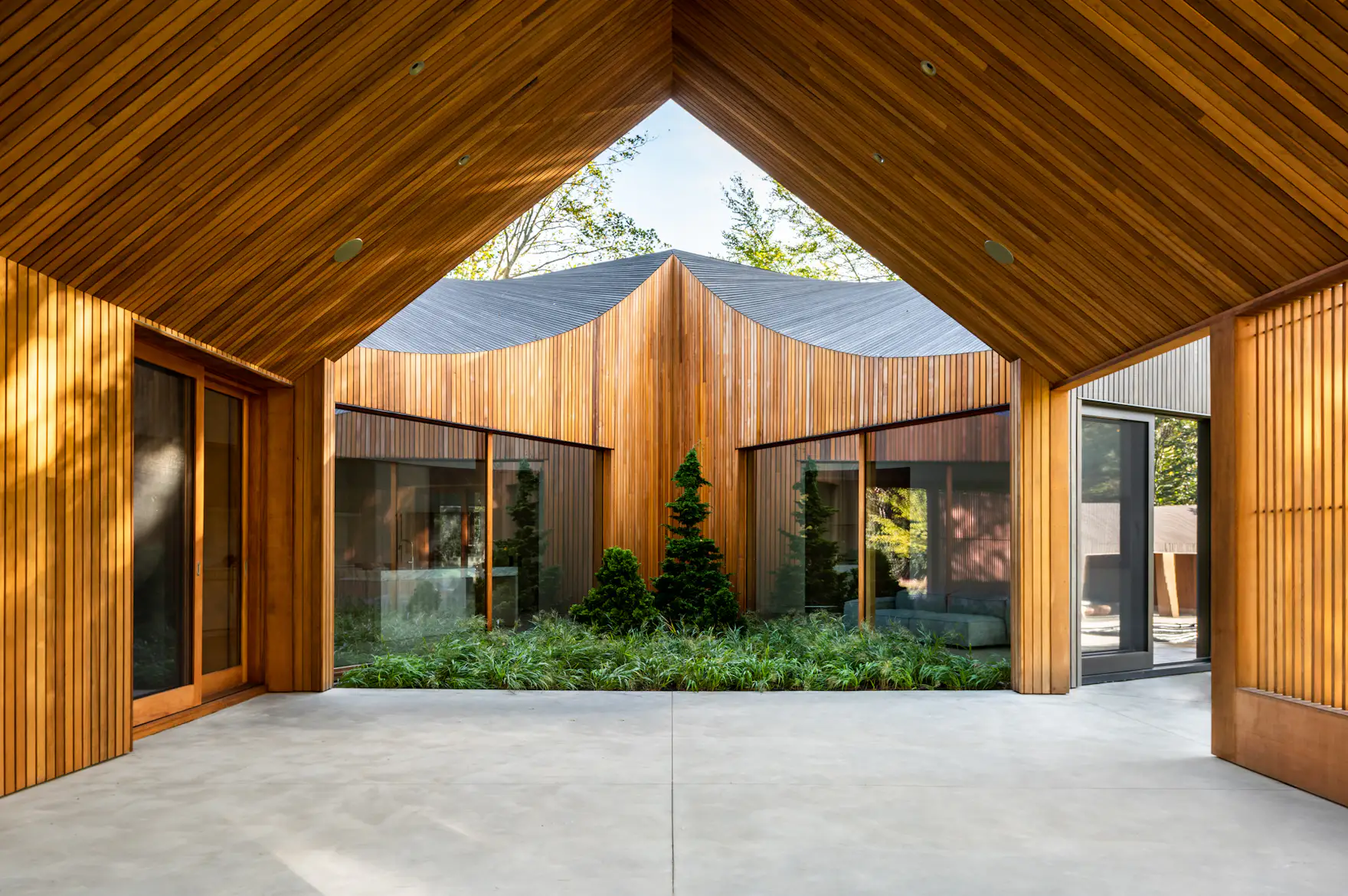 Photo 3 of 13 in An Undulating Roof Flows Across the Barn-Like Modules ...