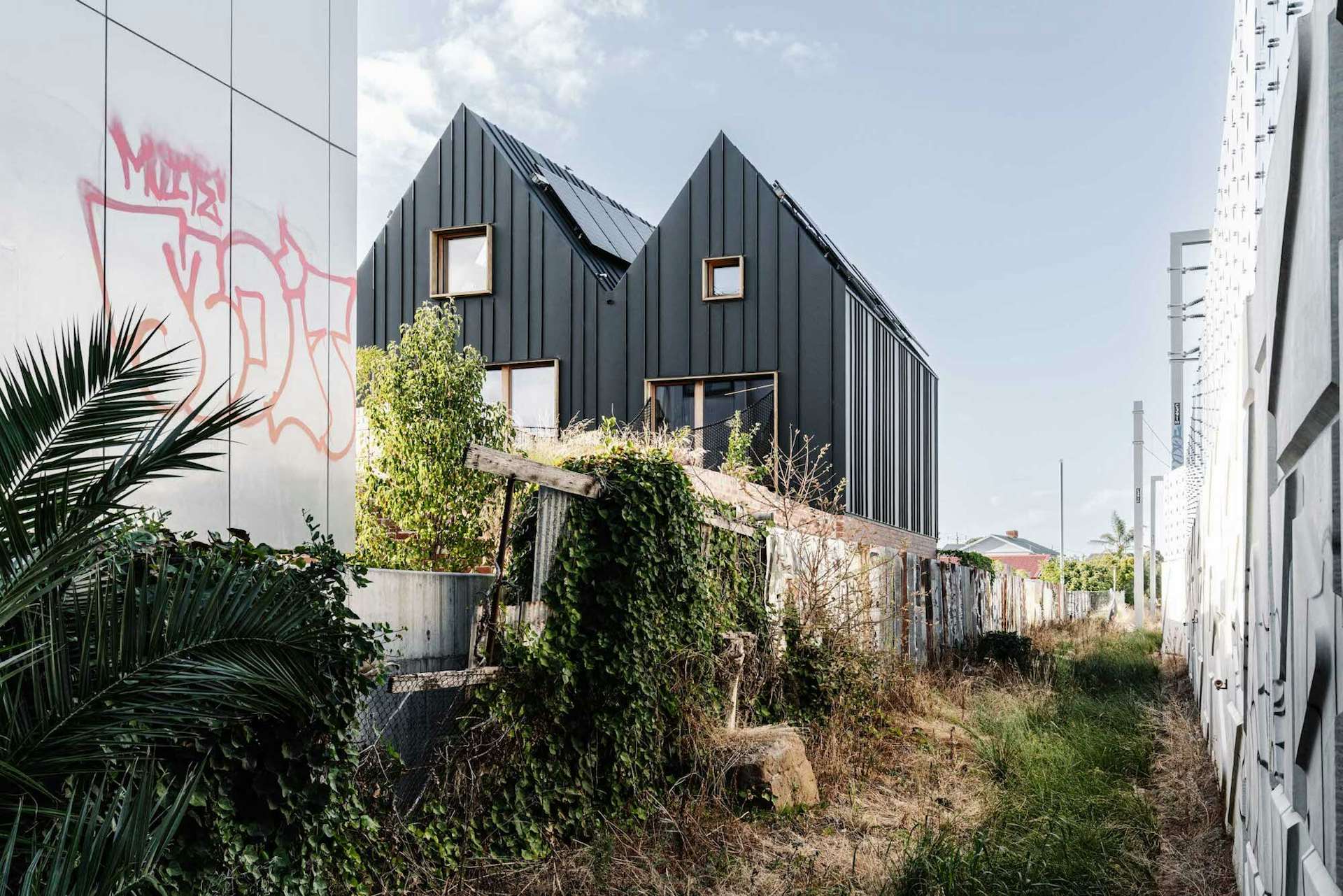 Photo 1 of 29 in A Striking Black Residence Energizes a Neglected Lot ...