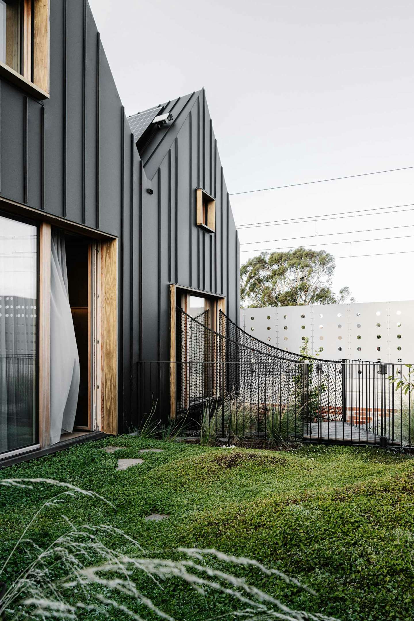 Photo 4 of 29 in A Striking Black Residence Energizes a Neglected Lot ...