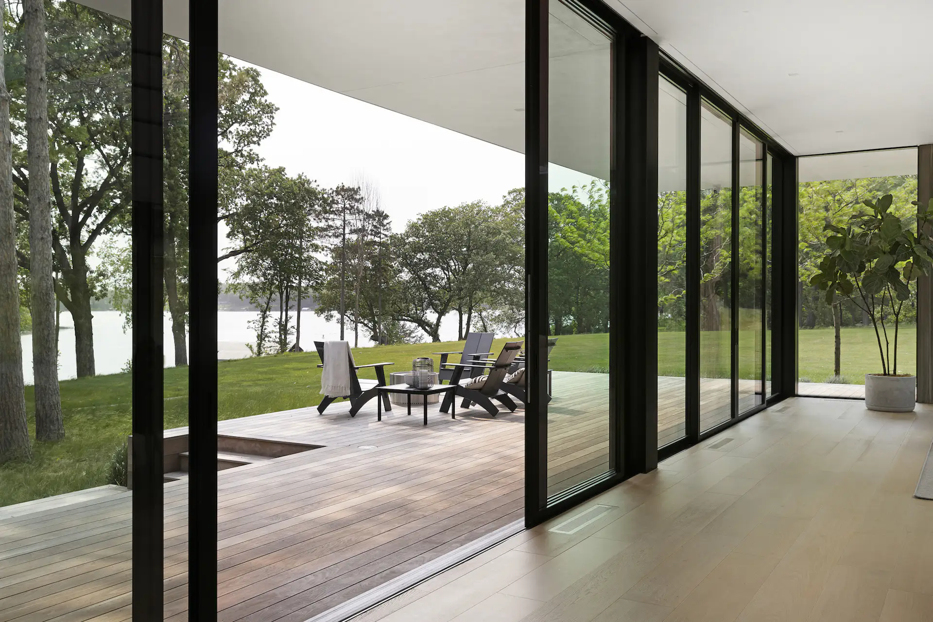 Photo 3 of 8 in This Glass Cabin Appears Barely There on the Shores of ...