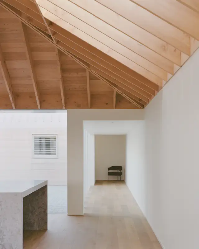 Photo 9 of 15 in Warm Wood Finishes Sandwich the White Interiors of a ...