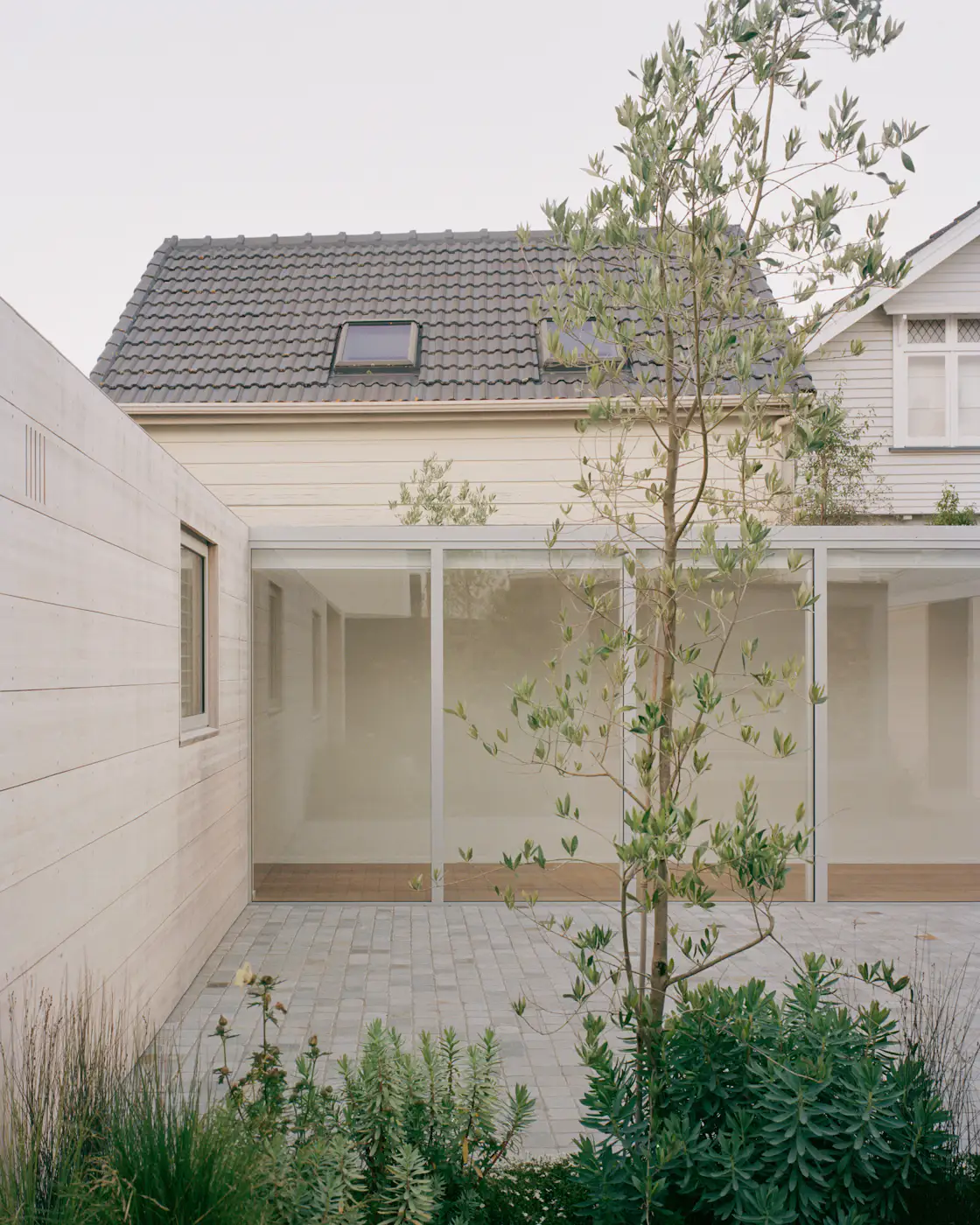 Photo 12 of 15 in Warm Wood Finishes Sandwich the White Interiors of a ...