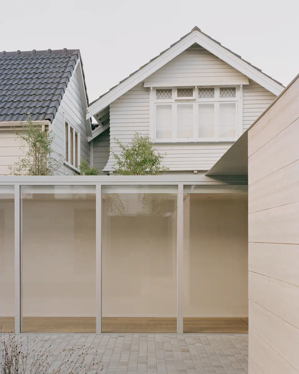 Photo 13 of 15 in Warm Wood Finishes Sandwich the White Interiors of a ...