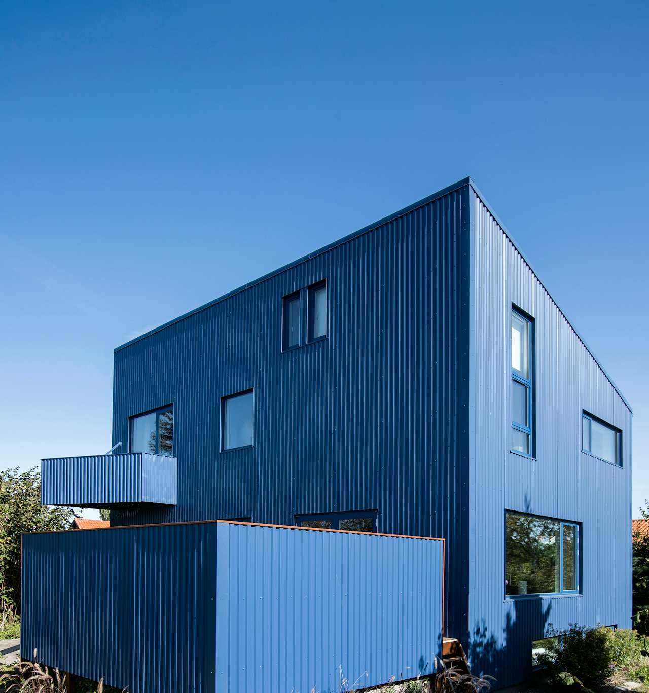 Photo 3 of 14 in A Blue House Clad With Corrugated Steel Blends Into ...