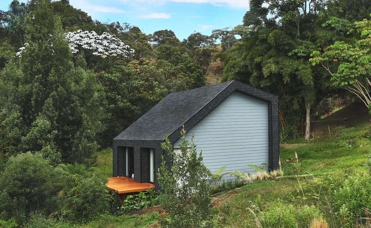 Photo 3 of 11 in A Colombian Cabin Uses Shingles as Camouflage in Its ...