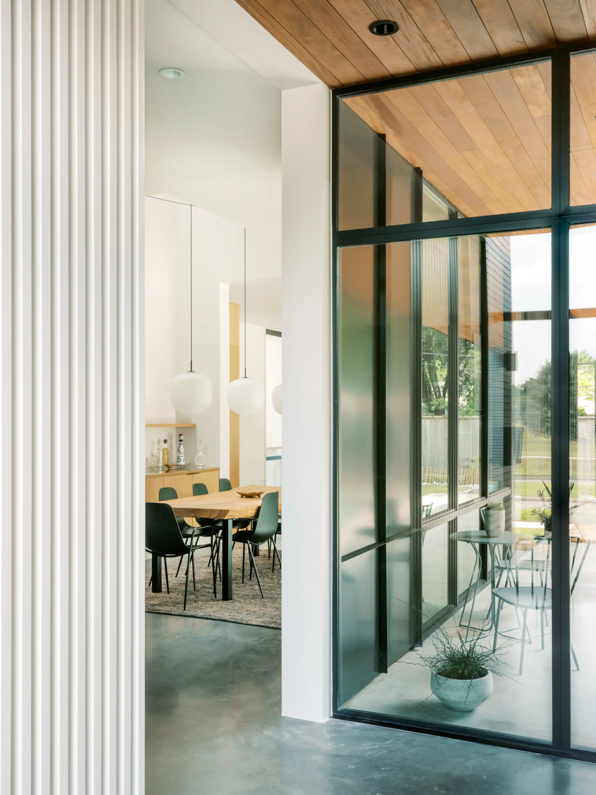 Tile, Texas Stone, and Concrete Rule in This Soaring Houston Home - Dwell