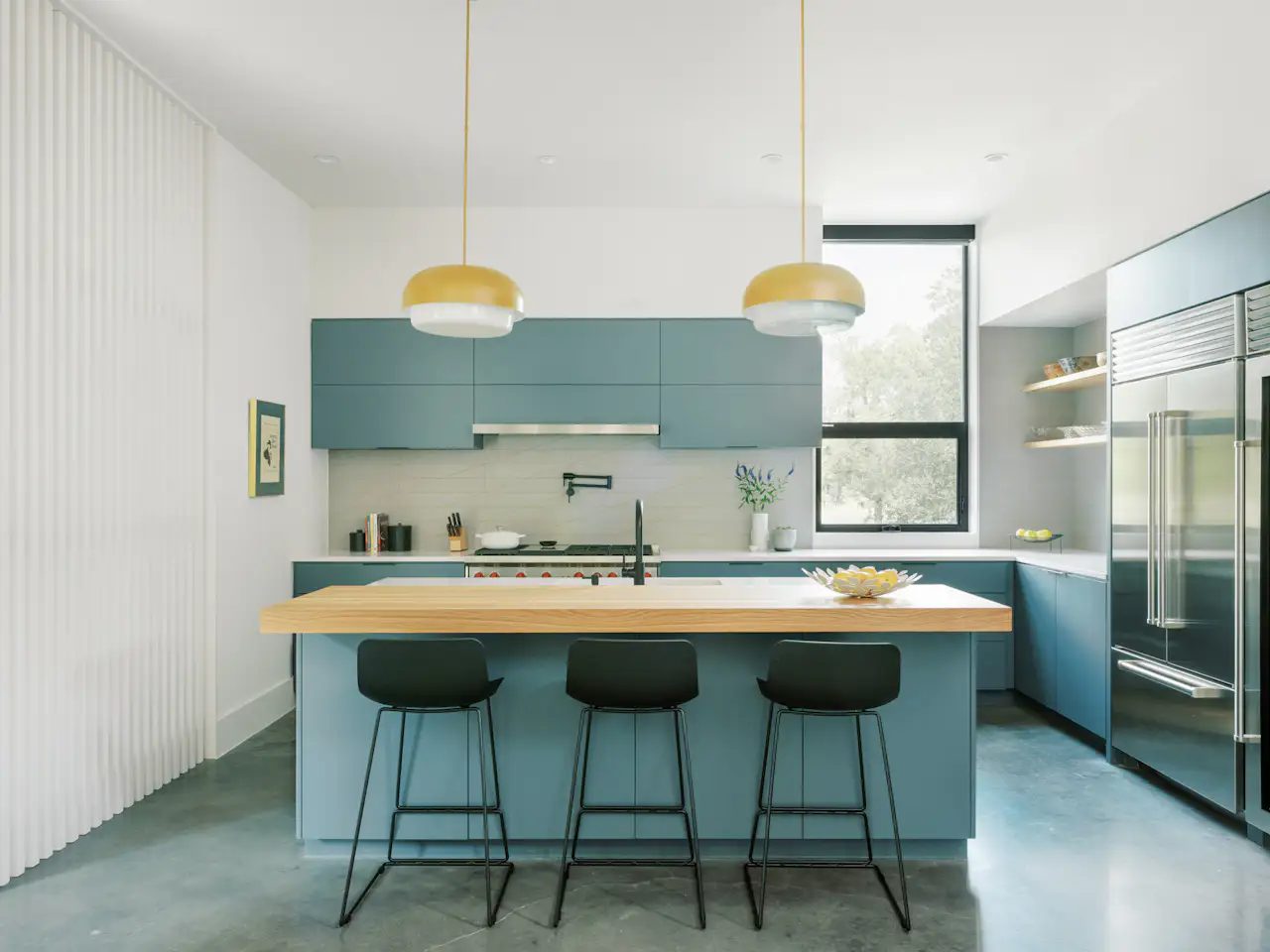 Tile, Texas Stone, and Concrete Rule in This Soaring Houston Home - Dwell
