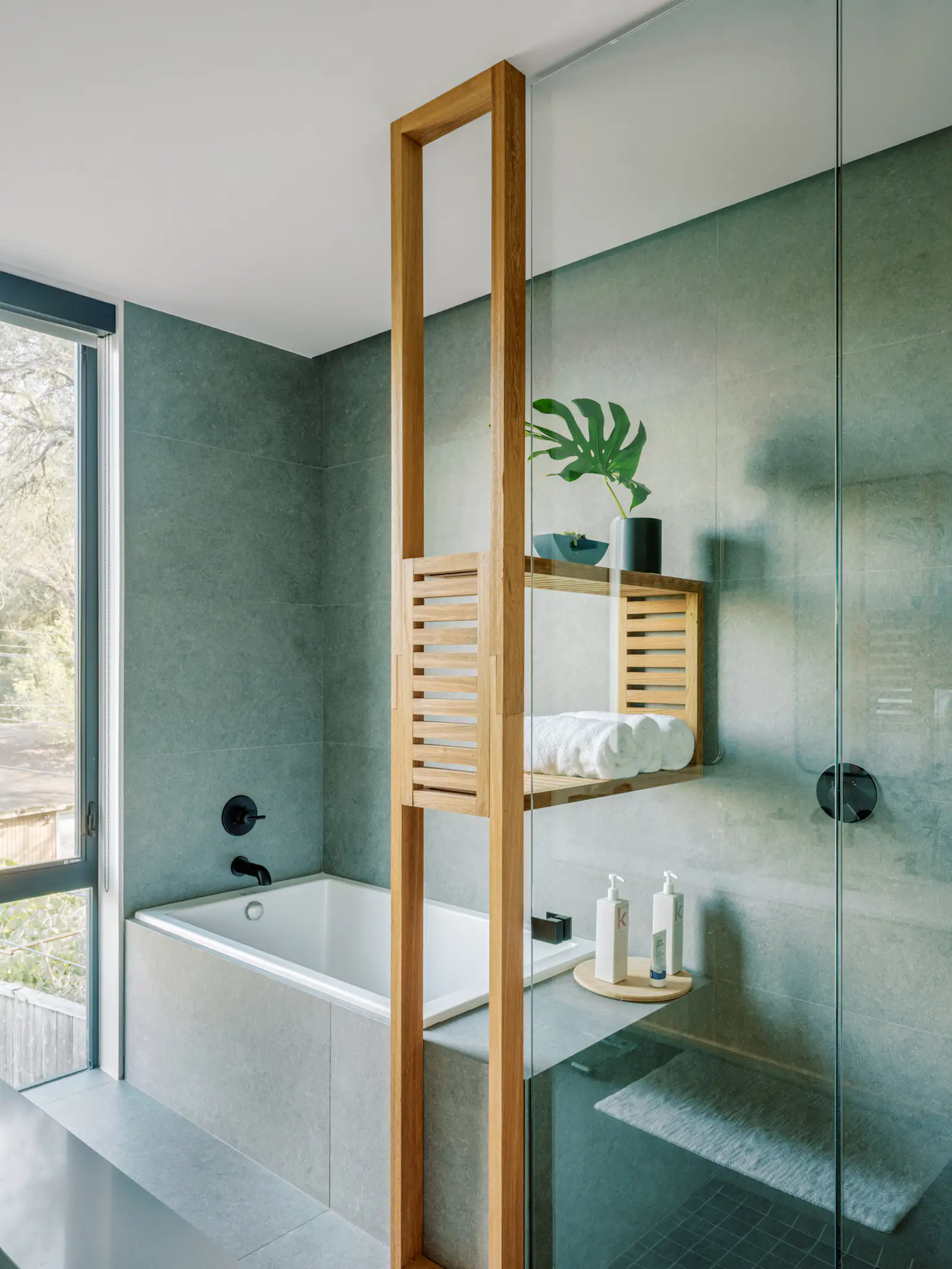 Tile, Texas Stone, and Concrete Rule in This Soaring Houston Home - Dwell