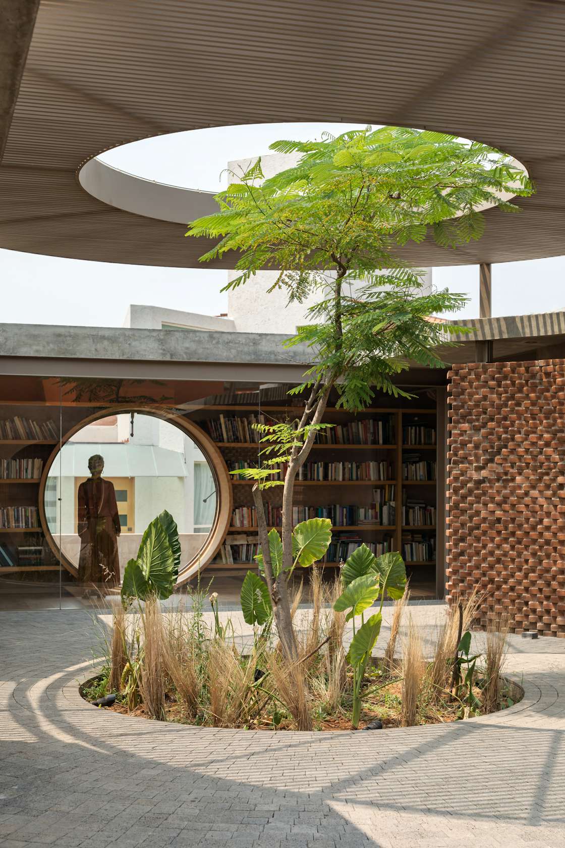 Photo 2 of 14 in A Brick-and-Concrete Home With a Library Emphasizes ...