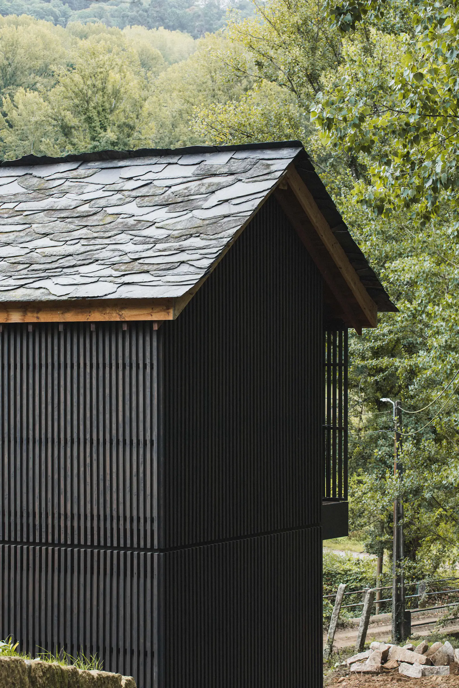In a Forest in Portugal, a Refined Timber Home Is Hewn From a ...