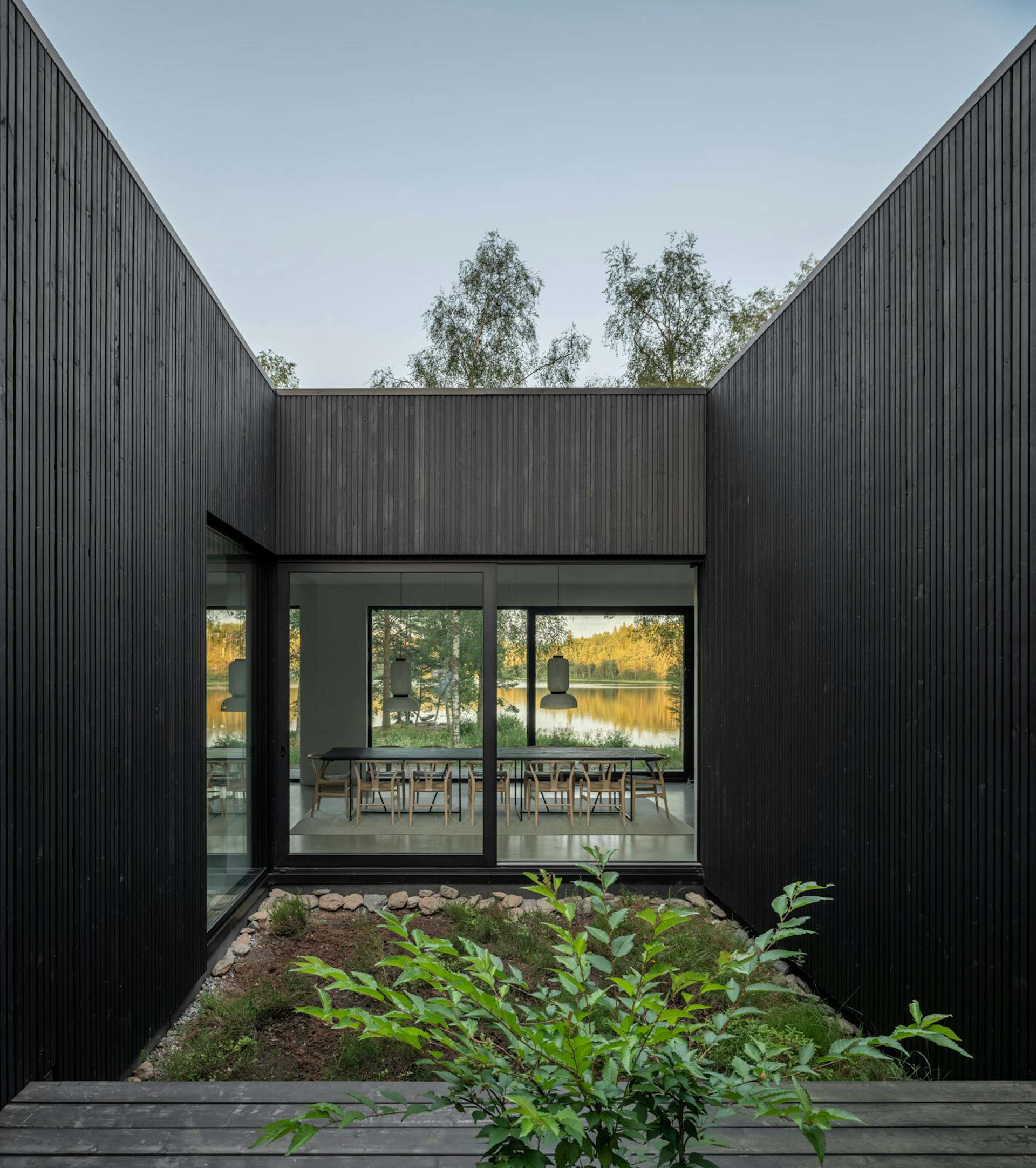 Photo 17 of 33 in Rhythmic Black Timber Makes This Swedish Cabin Pop ...