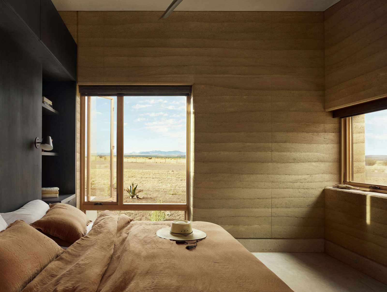 Photo 12 of 22 in Monolithic Rammed Earth Walls Keep This Marfa Ranch ...