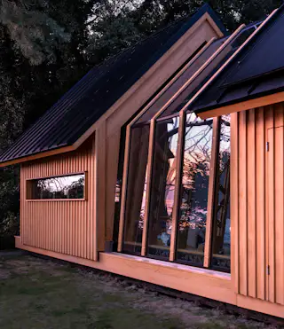 This $480K Prefab Cabin Slides Apart to Reveal a Glass Enclosed Room ...