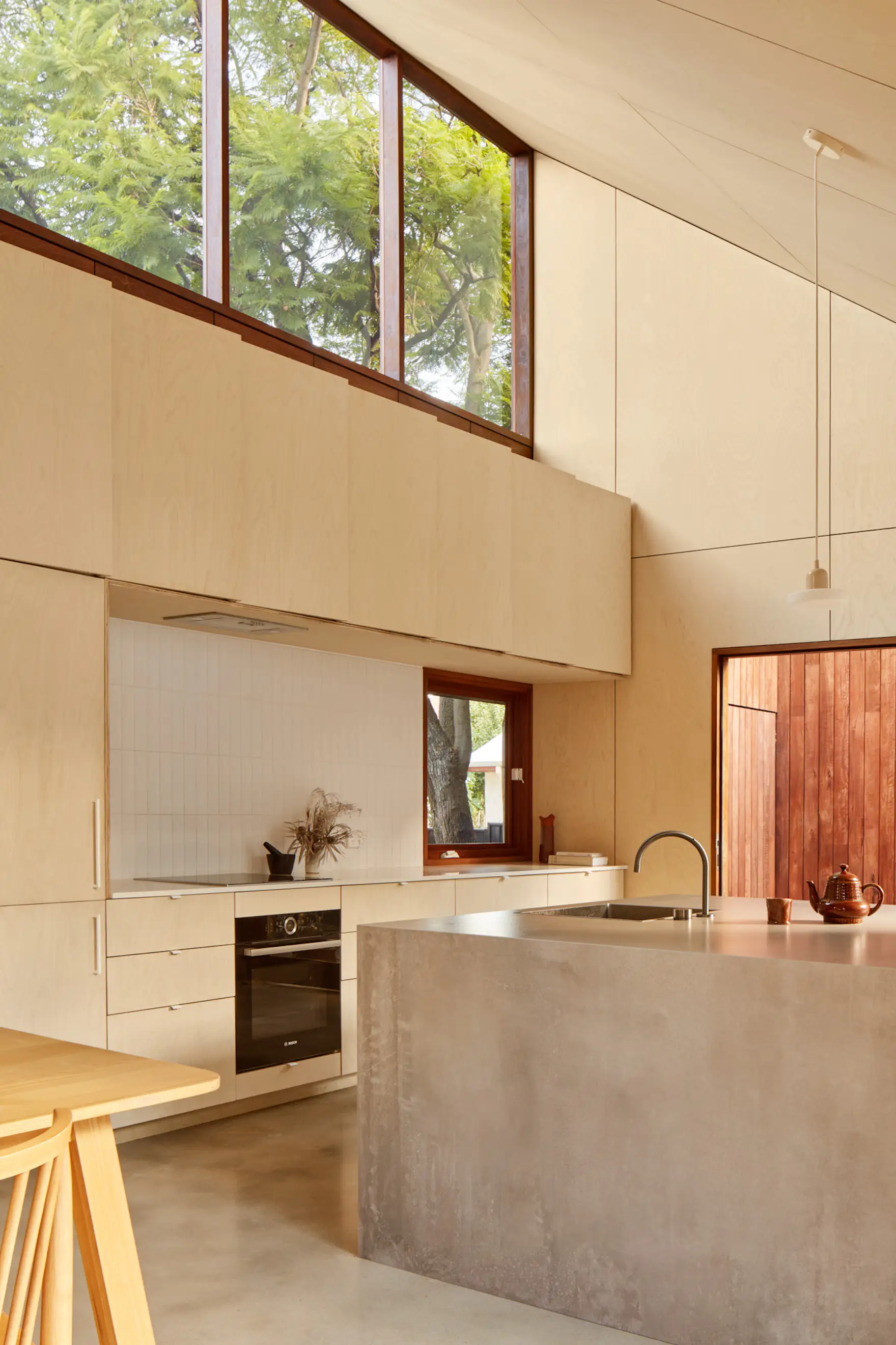 Dark Timber Cladding Hides a Soaring Extension at the Rear of This ...