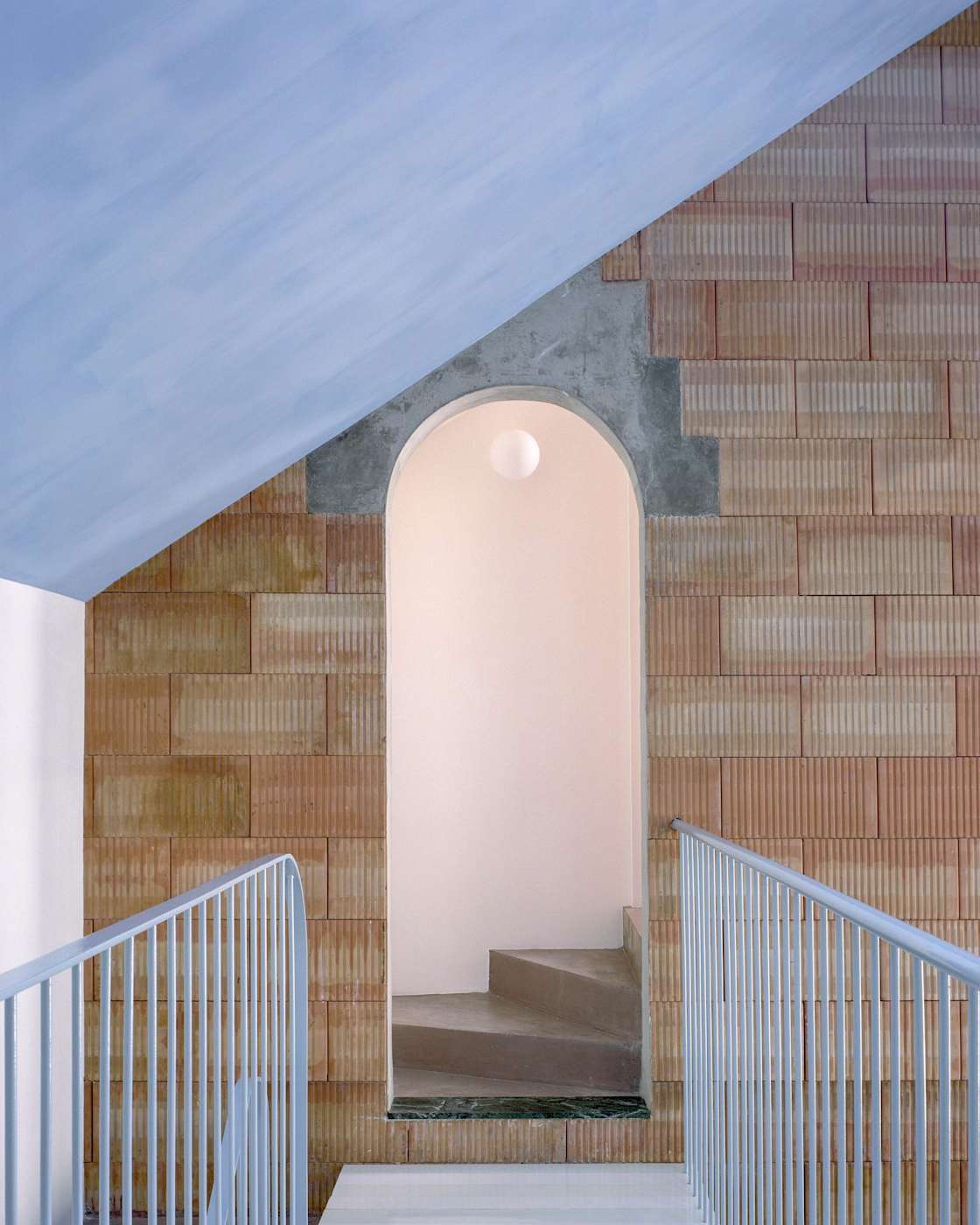 Photo 13 of 15 in Grooved Red Tile, Arches, and a Catwalk Tie Together ...