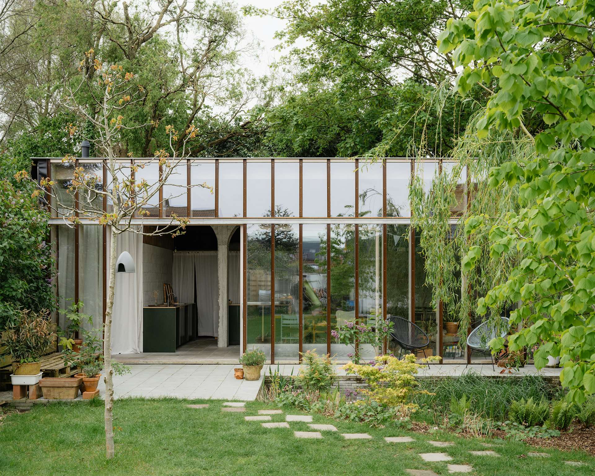 Photo 1 of 13 in A Surprising Concrete Column Keeps This Backyard House ...
