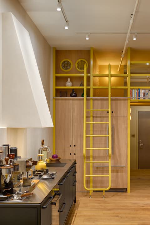 Photo 8 of 15 in A Yellow Floor-to-Ceiling Library Wall Brightens Up ...