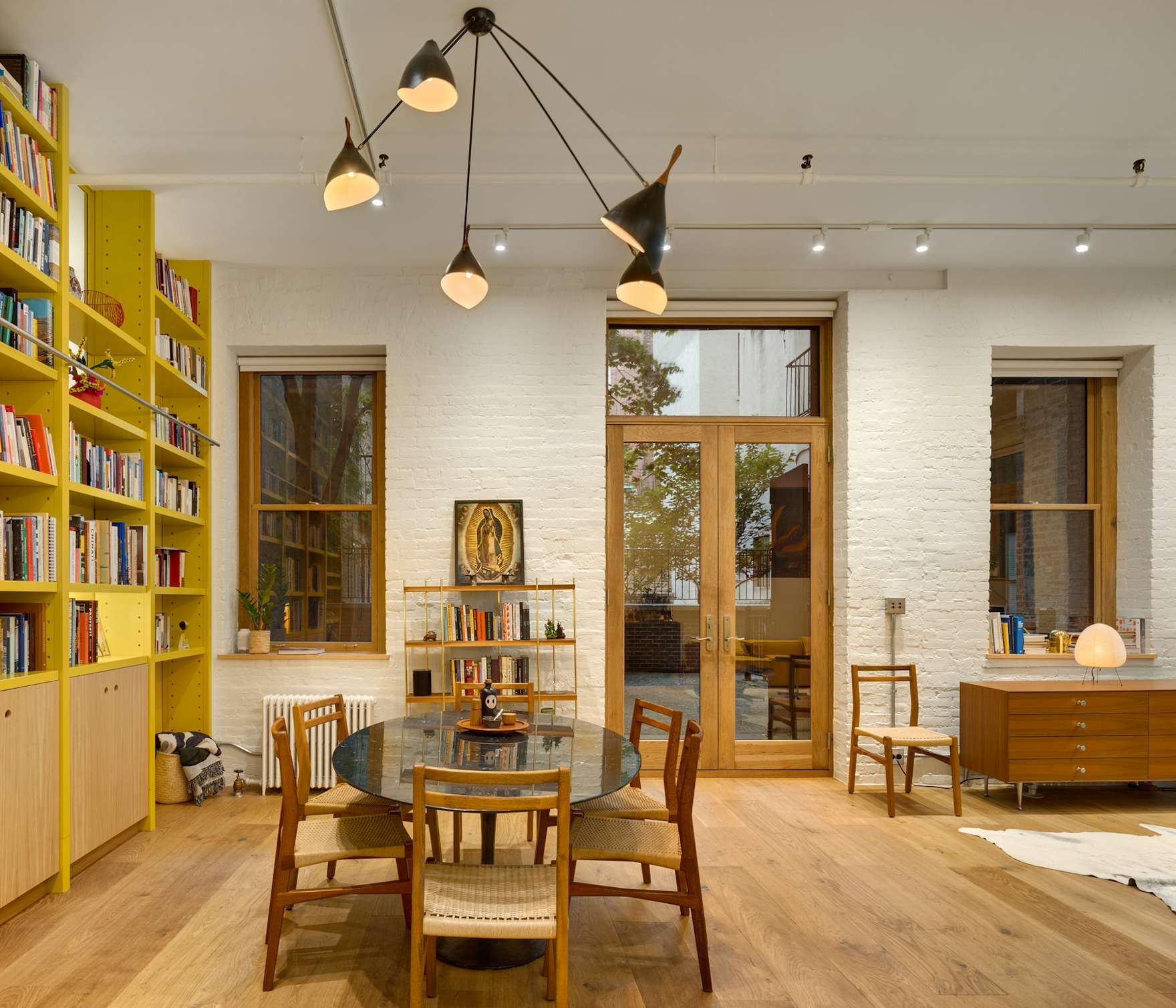 Photo 1 of 15 in A Yellow Floor-to-Ceiling Library Wall Brightens Up ...