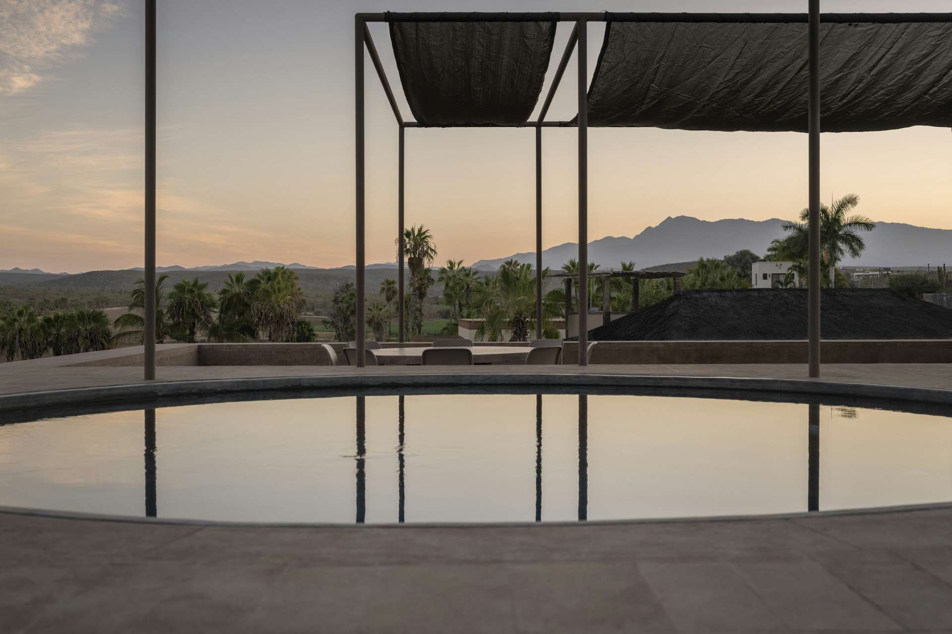 Photo 14 of 15 in A Dusty-Pink Rammed Earth Home Appears to Rise Out of ...