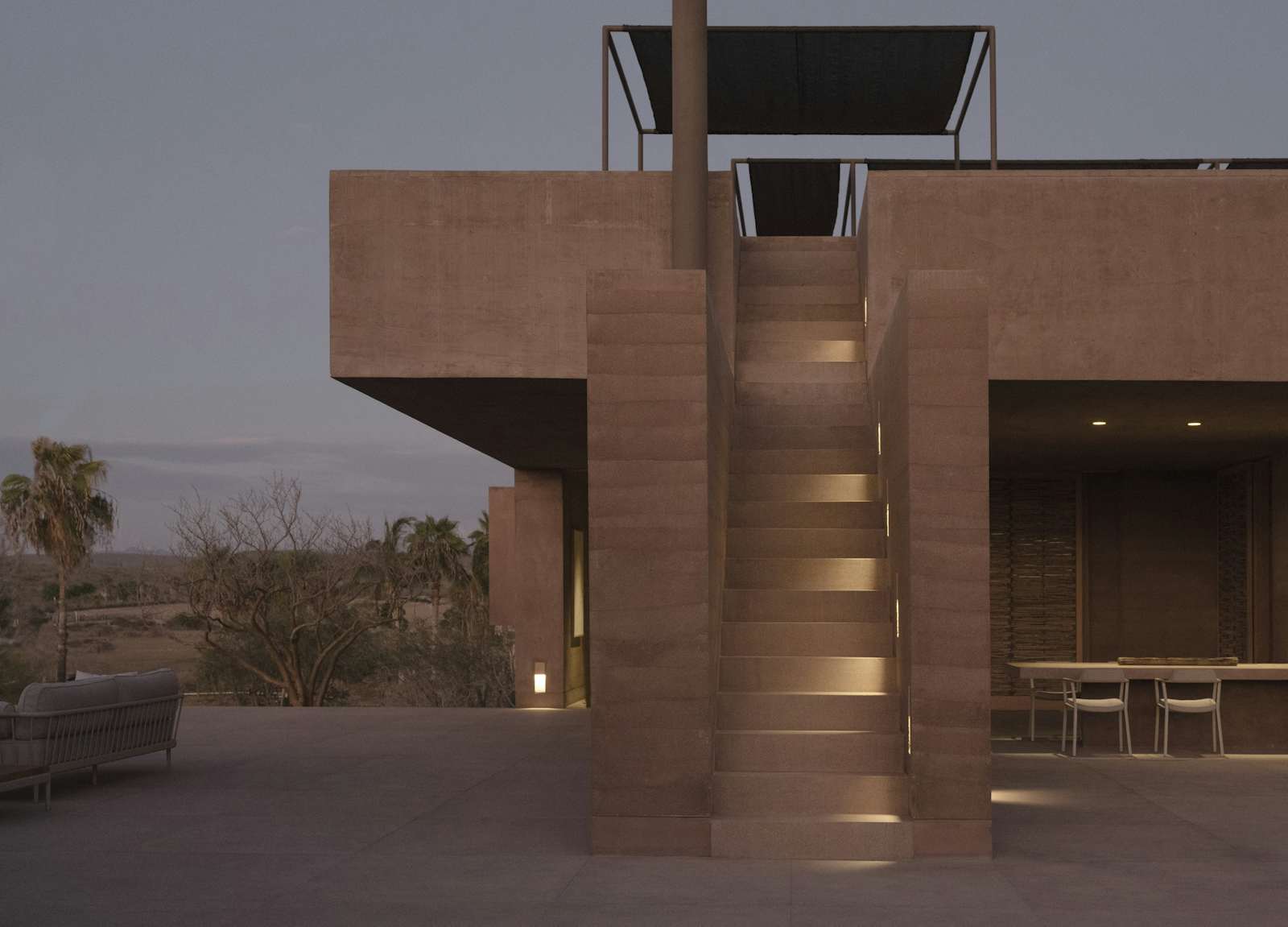 Photo 10 of 15 in A Dusty-Pink Rammed Earth Home Appears to Rise Out of ...