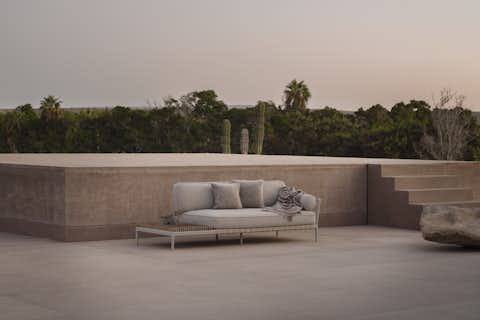 Photo 14 of 15 in A Dusty-Pink Rammed Earth Home Appears to Rise Out of ...